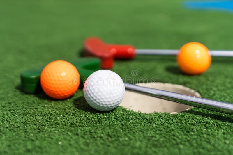 Close-up of Miniature Golf Hole with Bat and Ball Stock Photo - Image ...