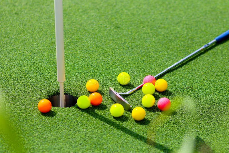 Close-up of Miniature Golf Hole with Bat and Ball Stock Image - Image ...