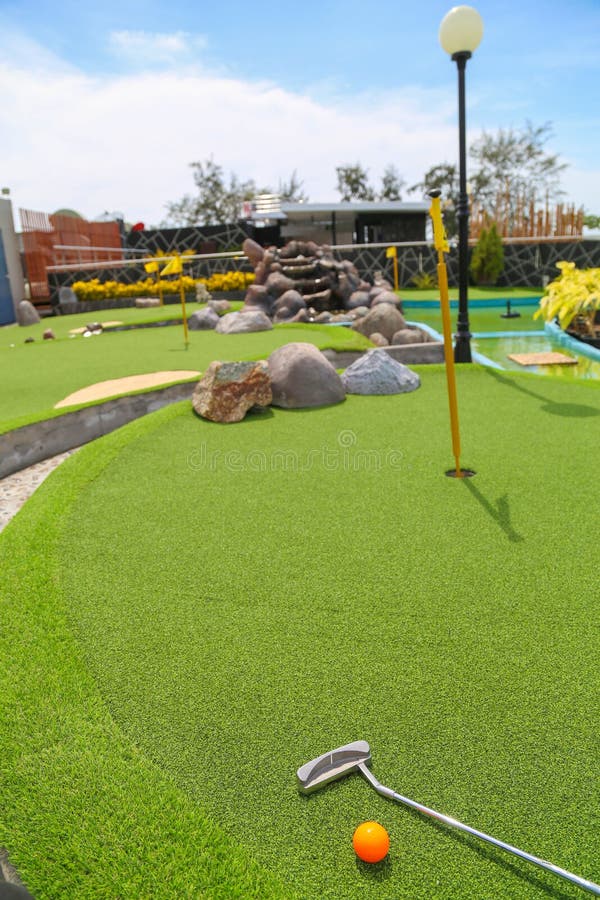 Close-up of Miniature Golf Hole with Bat and Ball. Stock Photo - Image ...