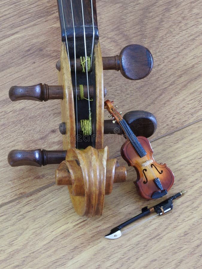 Close-up of the Miniature of a Violin with Bow Propped Up on a Full ...