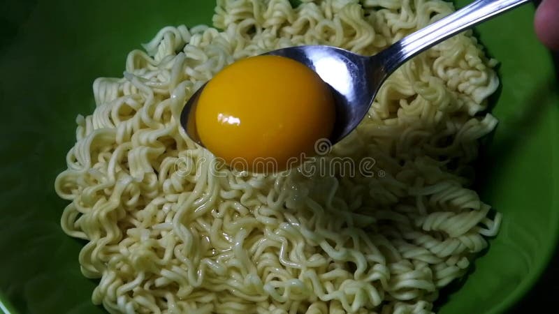Close Up of Mixing Instant Doodles and Egg To Make an Instant Noodle ...