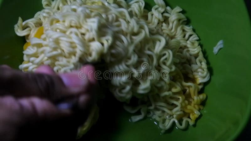 Close Up of Mixing Instant Doodles and Egg To Make an Instant Noodle ...