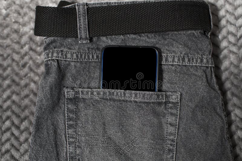 Close-up of a Mobile Phone in the Back Pocket of Jeans. Stock Image ...