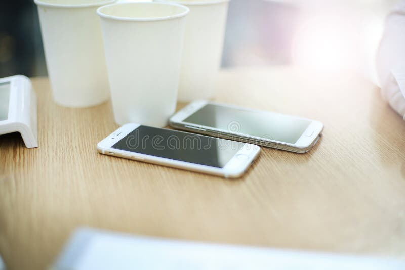 Close Up of Mobile Smart Phones on Wooden Tables Stock Photo - Image of ...