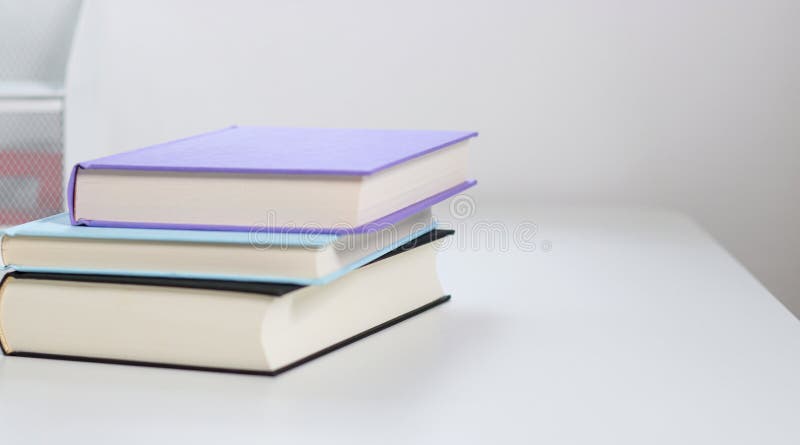 Close Up Mock Up Books Stack on White Table with Copy Space Stock Image ...