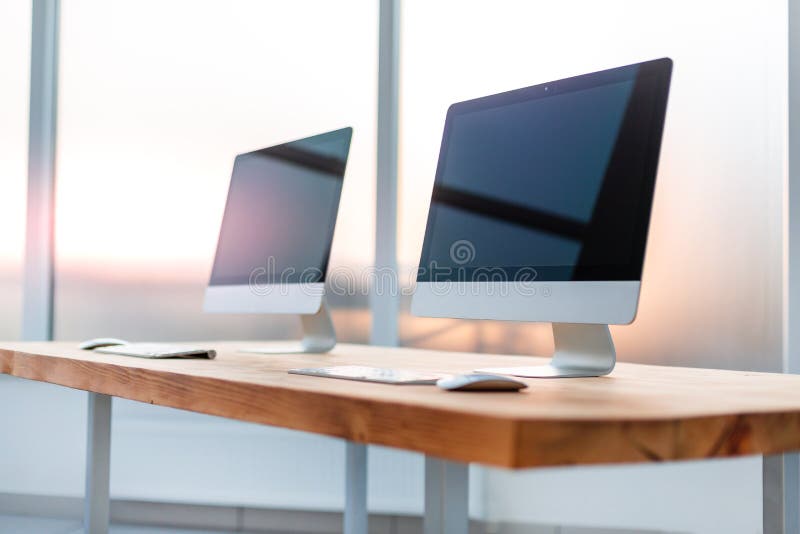 Close Up. Modern Computers on a Wooden Table Stock Photo - Image of ...