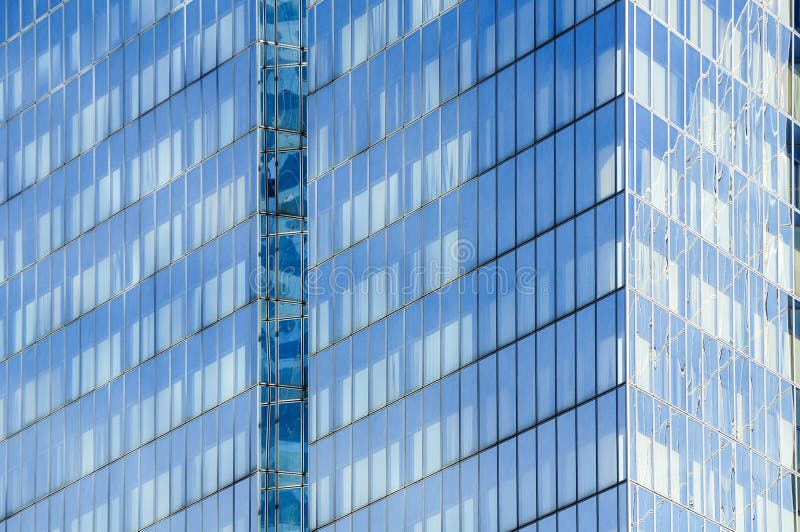 A Close-up of the Modern Glass Facade of a Skyscraper Reflecting ...