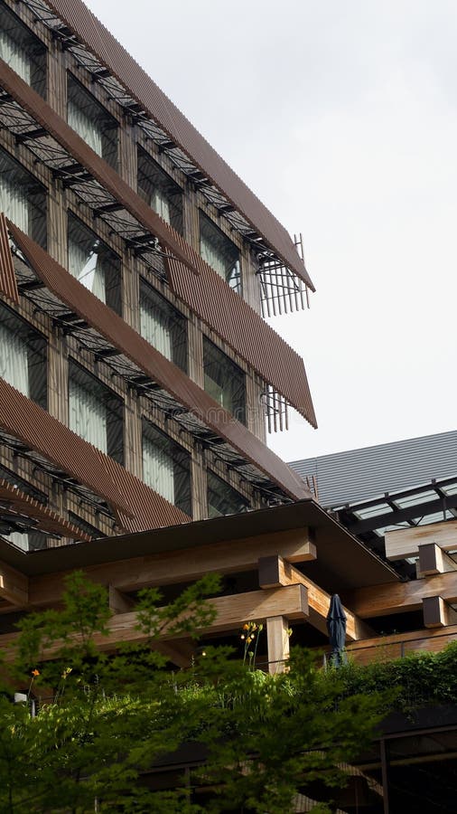 Close-up of a Modern-looking Building Surrounded by Lush Trees in the ...