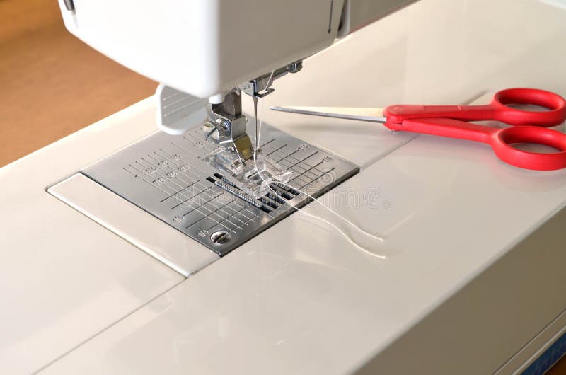 Close Up of Modern Sewing Machine with Scissors Stock Image - Image of ...