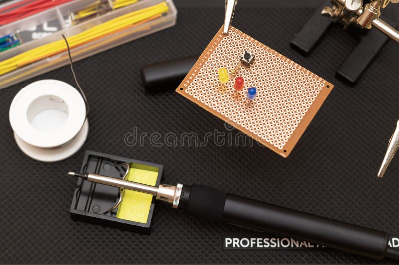 Close-up of a Modern Soldering Iron and Radio Components on a Black ...
