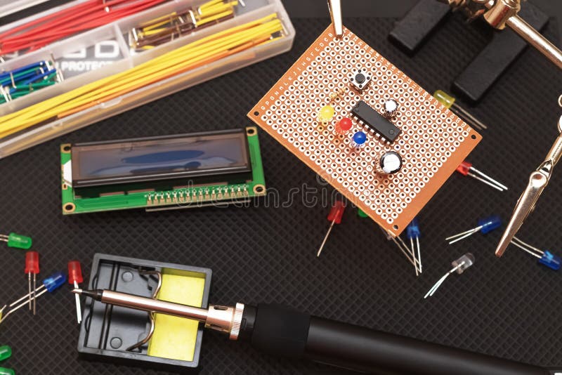 Close-up of a Modern Soldering Iron and Radio Components on a Black ...