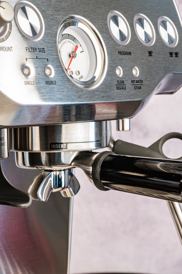 Close-up of a Modern Steel Coffee Machine with Control Buttons and a ...