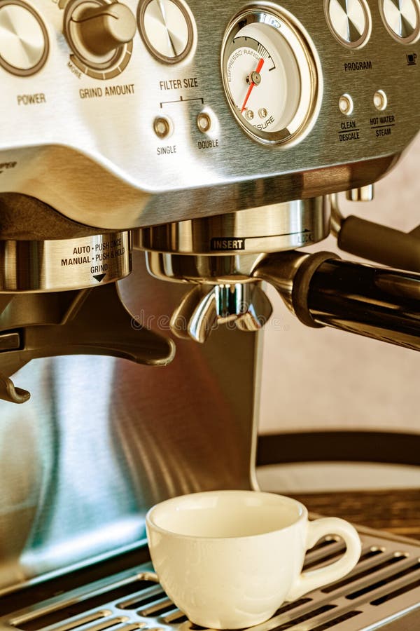 Close-up of a Modern Steel Coffee Machine with Control Buttons and a ...