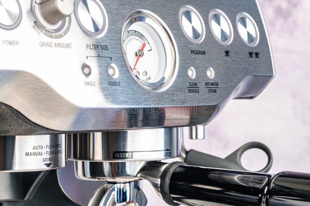 Close-up of a Modern Steel Coffee Maker with Control Buttons and a ...