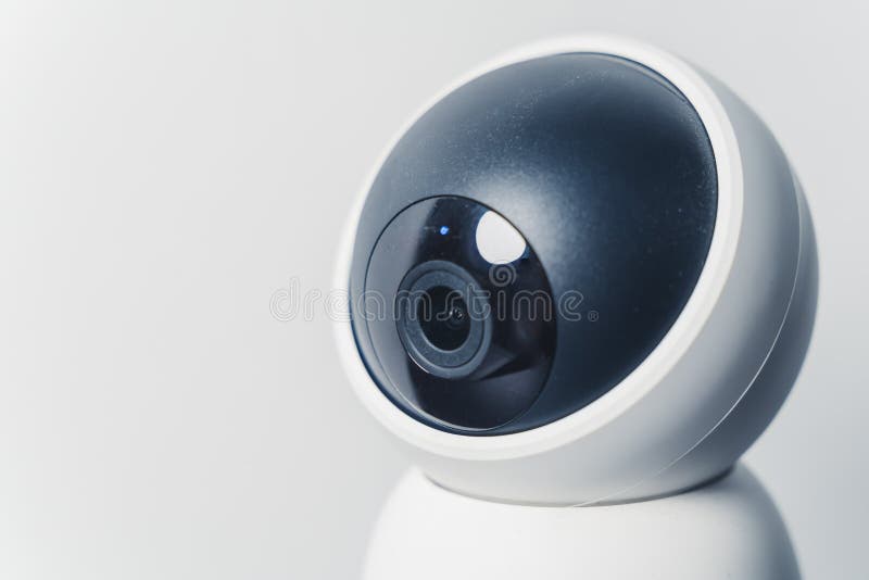 Close Up Modern Surveillance IP Camera on a White Wall. Security System ...