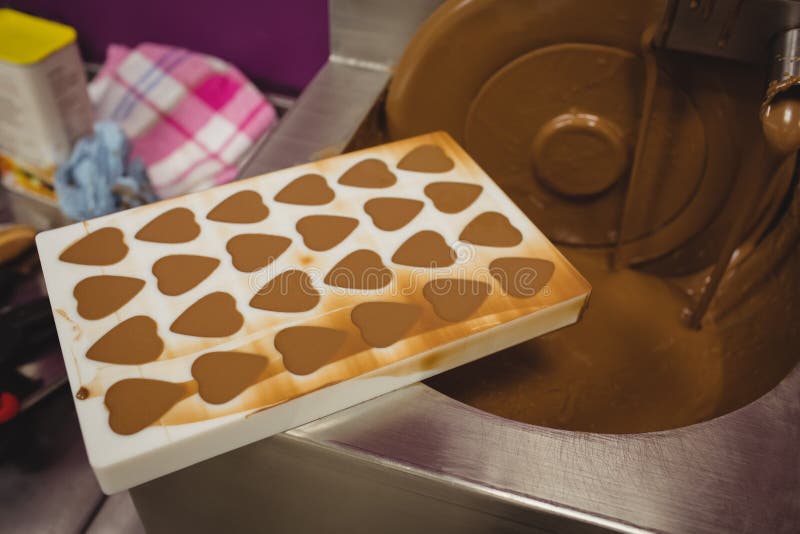 Close-up of Mould Filled with Melted Chocolate on Blending Machine ...