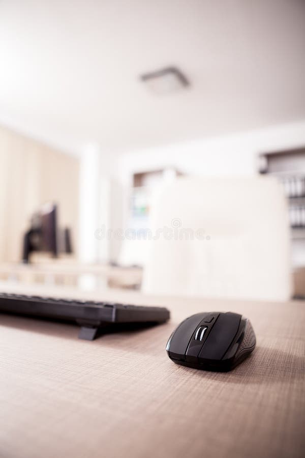 Close Up on Mouse and Keyboard in Modern Empty Office Stock Photo ...