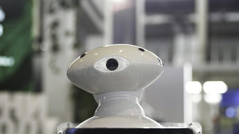 Close Up of the Moving Humanoid Robot with a Camera on His Head. Media ...