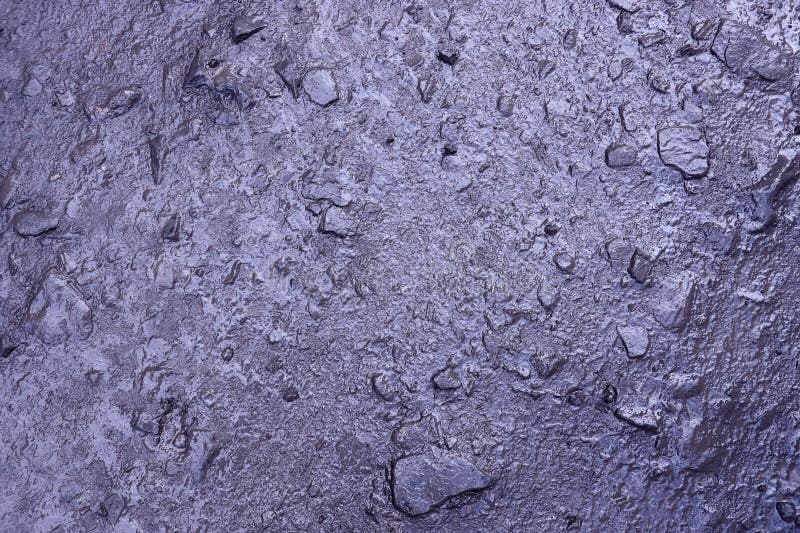 Close Up of Muddy Puddle with Small Stones on Wet Surface. Background ...