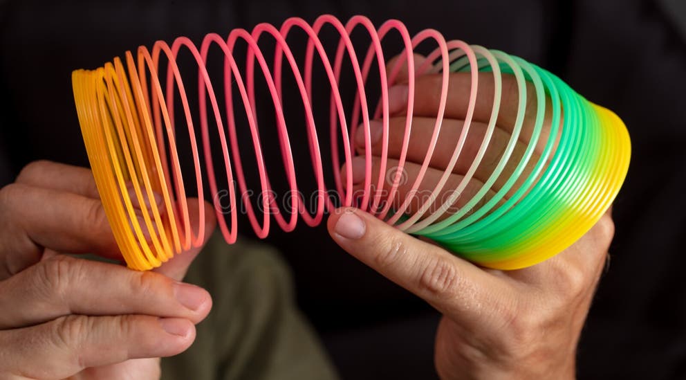 Close-up of a Multi-colored Slinky Spring in a Hand Editorial Stock ...