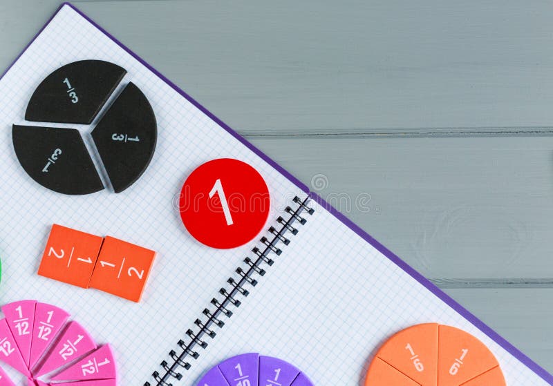 Close Up of Multicolored Math Fractions on the Open Notepad on Gray ...