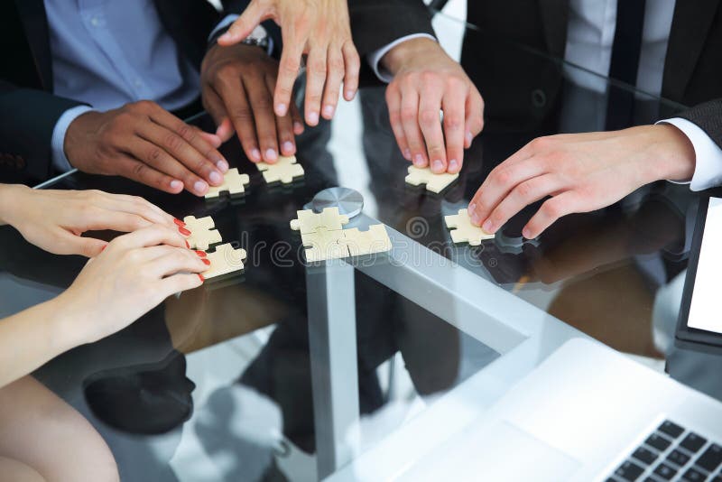 Close Up .multinational Business Team Assembling Puzzle. Stock Image ... Close Up .multinational Business Team Assembling Puzzle. Stock Image ...