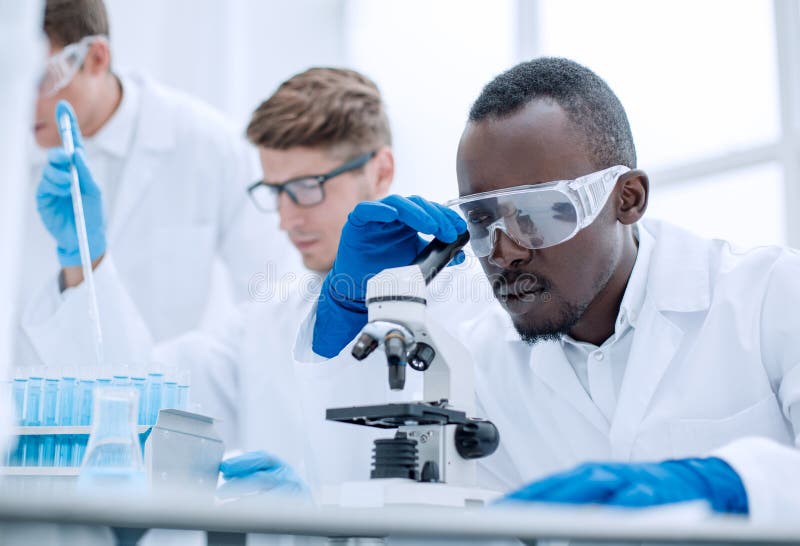 Close Up.a Multinational Group of Scientists is Conducting Research ...
