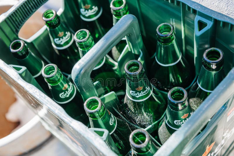 Close-up of Multiple Carlsberg Empty Glass Bottles of Beer in Plastic ...