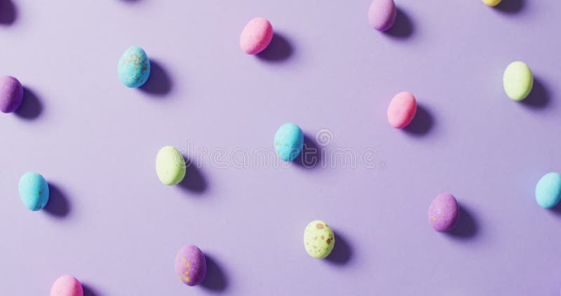 Close Up of Multiple Colorful Easter Eggs on Purple Background Stock ...