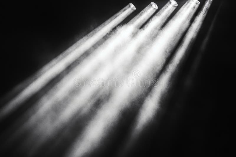 Close Up of Multiple Light Beams Shining through Smoke Against a Black ...