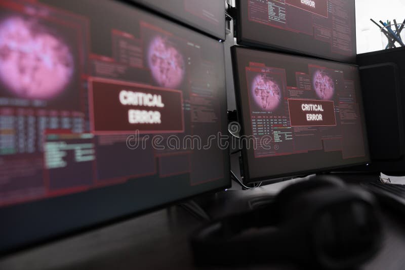 Close Up Of Multiple Monitors Having Critical Error Message On Display