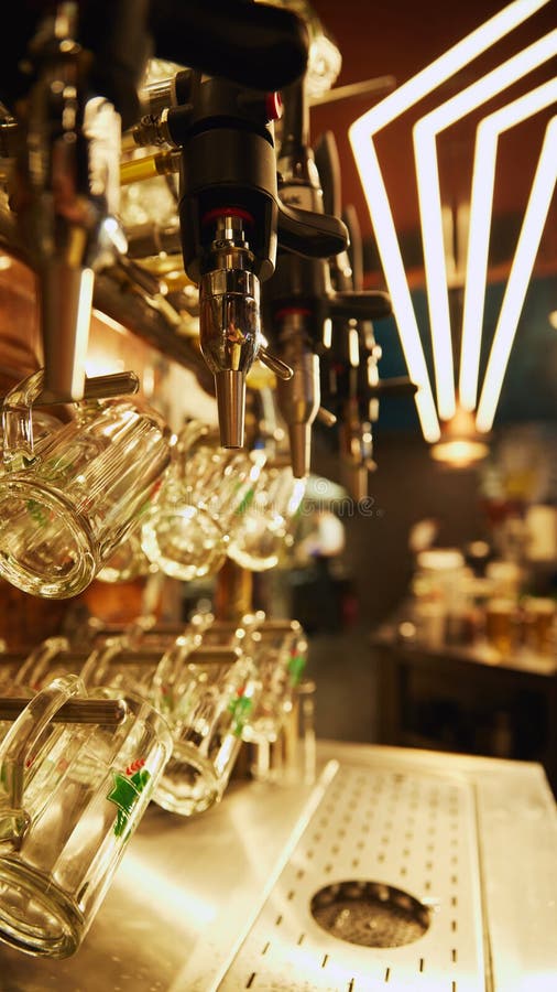 Close-up of Multiple Shiny Beer Taps with Handless, Set Against Blurred ...