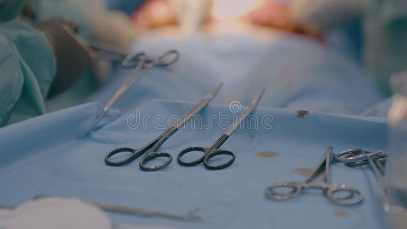 Close Up Multiple Surgery Tools on Table in Operating Room Team ...