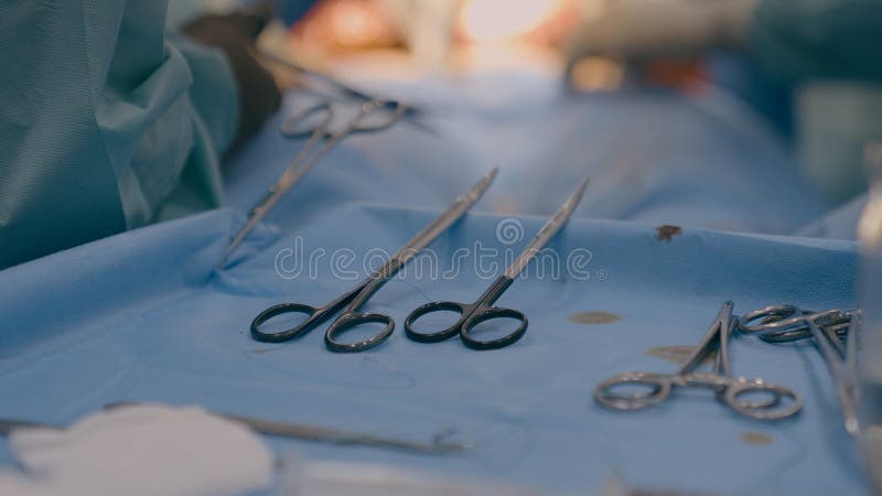 Close Up Multiple Surgery Tools on Table in Operating Room Team ...