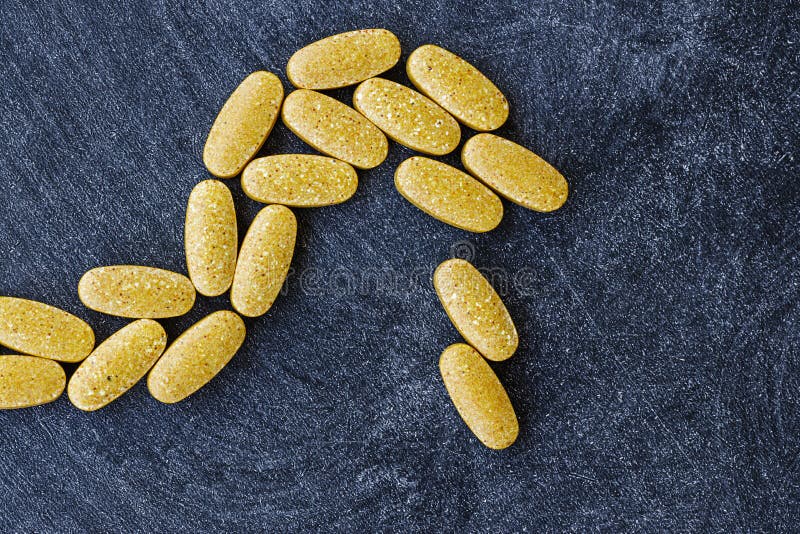 Close-up of Multivitamin and Mineral Supplement Tablets. Dietary ...