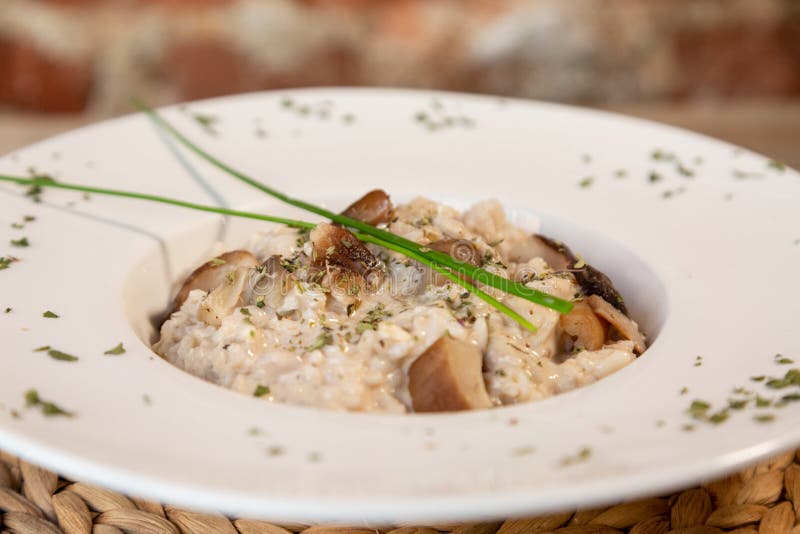 A Close Up of Mushroom Risotto Garnish with Oregano Stock Photo - Image ...
