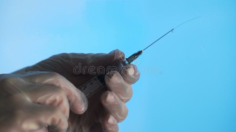 Close-up of a Needle from a Disposable Syringe. a Small Syringe Pushes ...