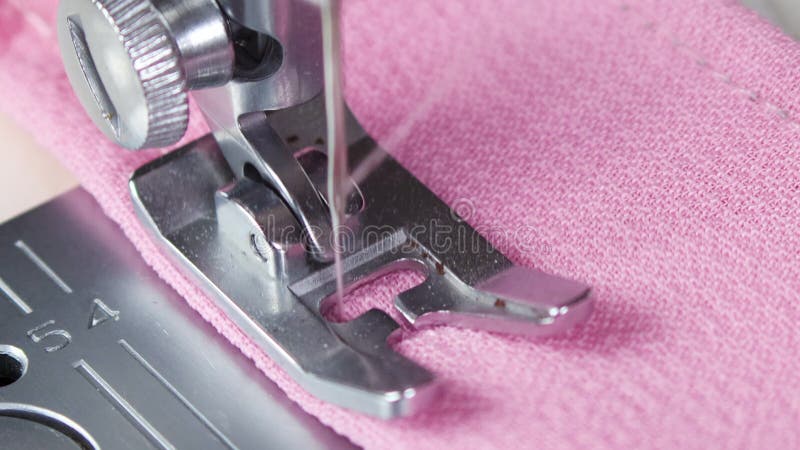 Close Up of Needle Moving and Sewing on Sewing Machine. Sewing Pink ...