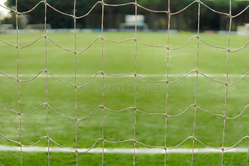 Close-up of the Net of an Empty Soccer Goal. Soccer Stadium through the ...
