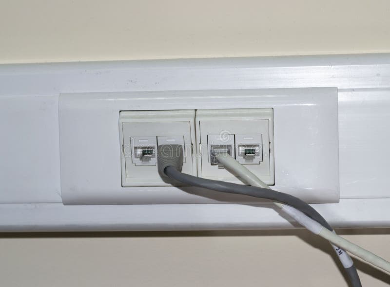 Close-up Network Cable Plugged into a Wall Socket Stock Photo - Image ...