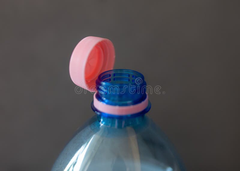 Close Up of New Cap Attached To Plastic Bottle, Connected To the Neck ...