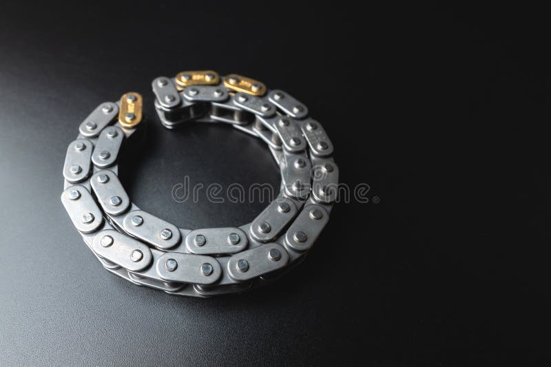 Close-up New Cylinder Head Timing Chain on Black Moth. Engine Parts ...