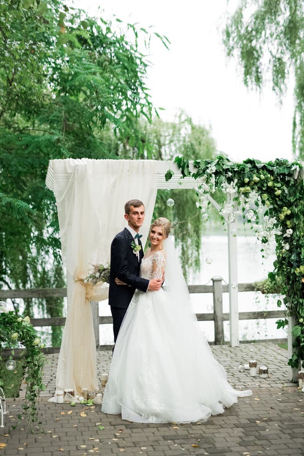 Close Up of a Nice Young Wedding Couple Stock Image - Image of flowers ...