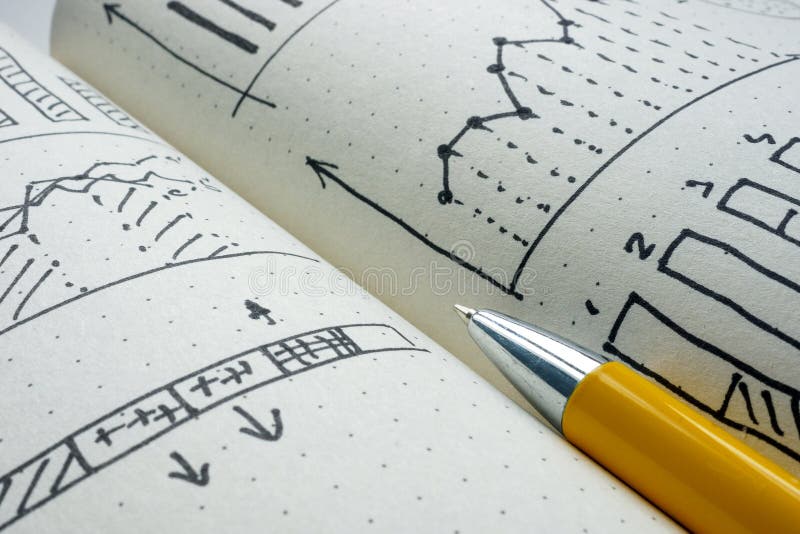 Close-up of a Notebook with Financial Charts, and Pen. Financial ...