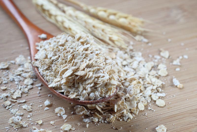 Close Up of Oats Flakes on Spoon on Table Stock Image - Image of ...