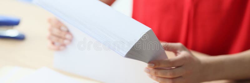 Close-up of Office Manager Holding Stack of Blank Paper while Sitting ...