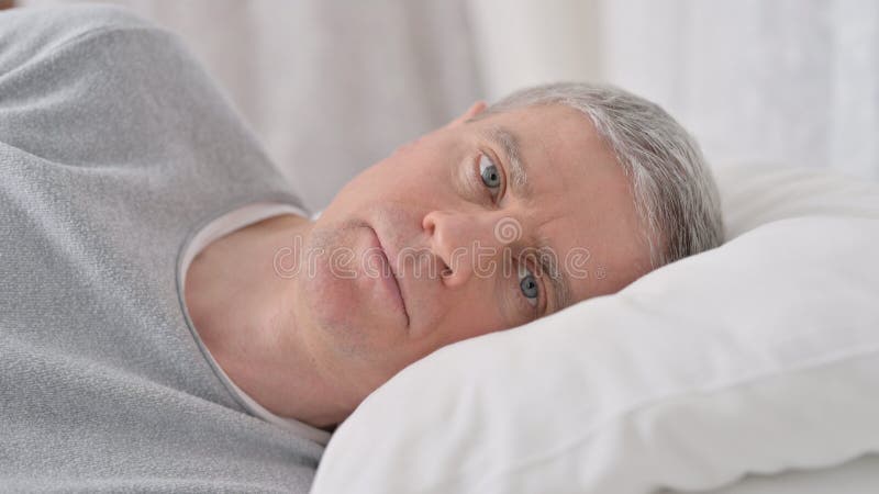 Close Up of Old Man Awake in Bed Thinking Stock Image - Image of ...