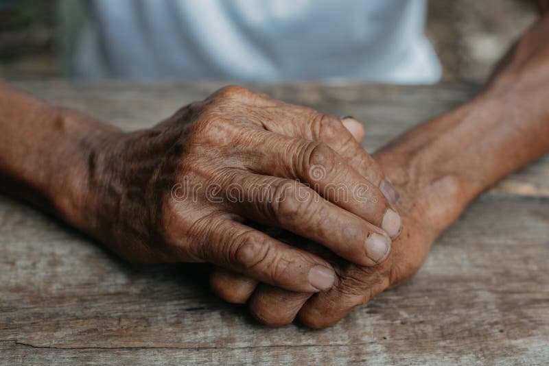 Close-up of Old Man S Hands Resting on Wood Stock Photo - Image of ...