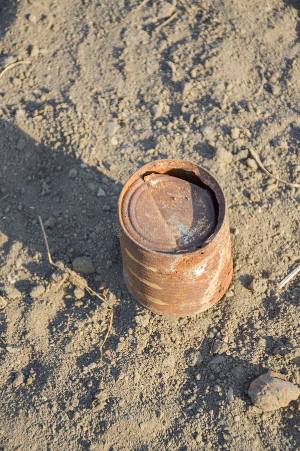 Old Rusty Can on the Ground Stock Photo - Image of dirty, ground: 166443016