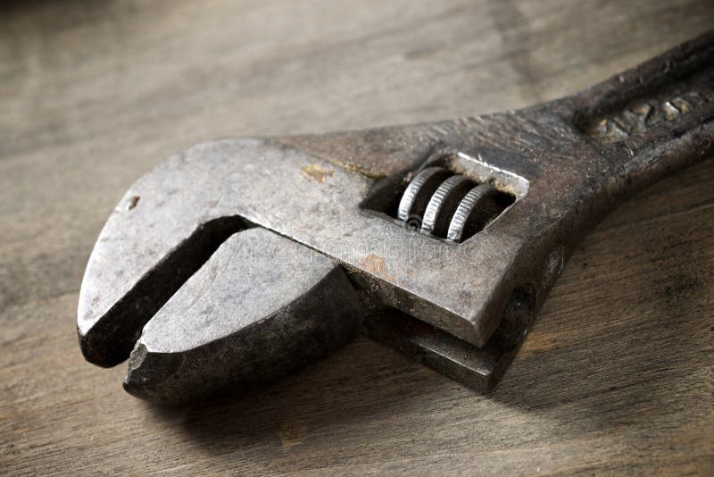 Old Wrench on a Wooden Table Stock Photo - Image of dirty, wrench ...